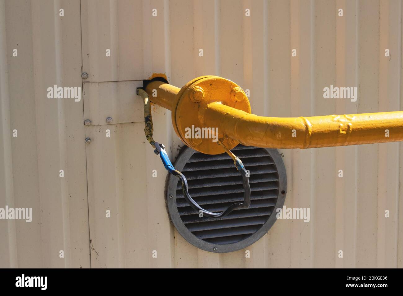 Yellow gas pipe connector system close up Stock Photo - Alamy