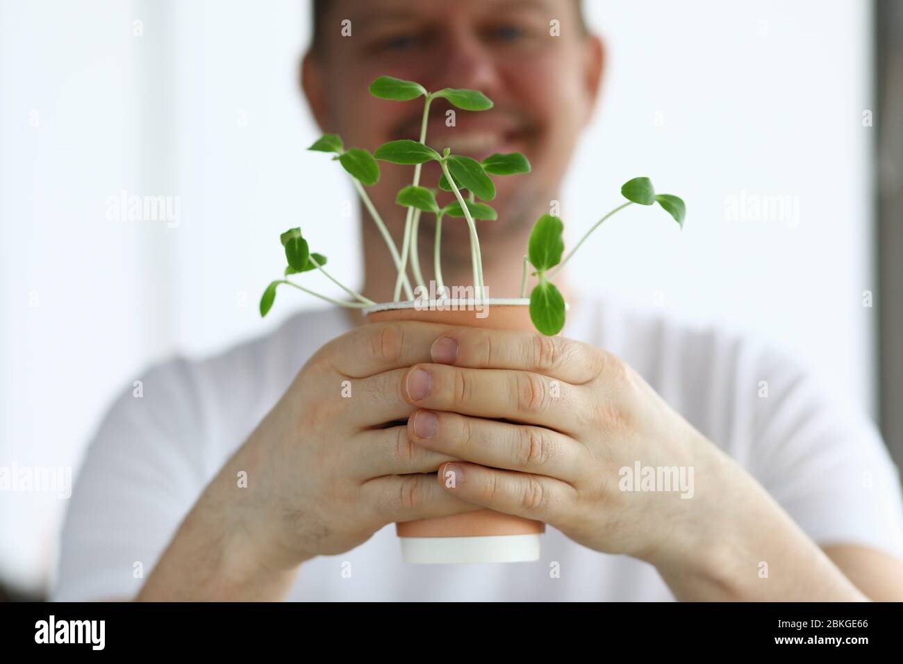 Man in white tshirt smiling hi-res stock photography and images - Alamy