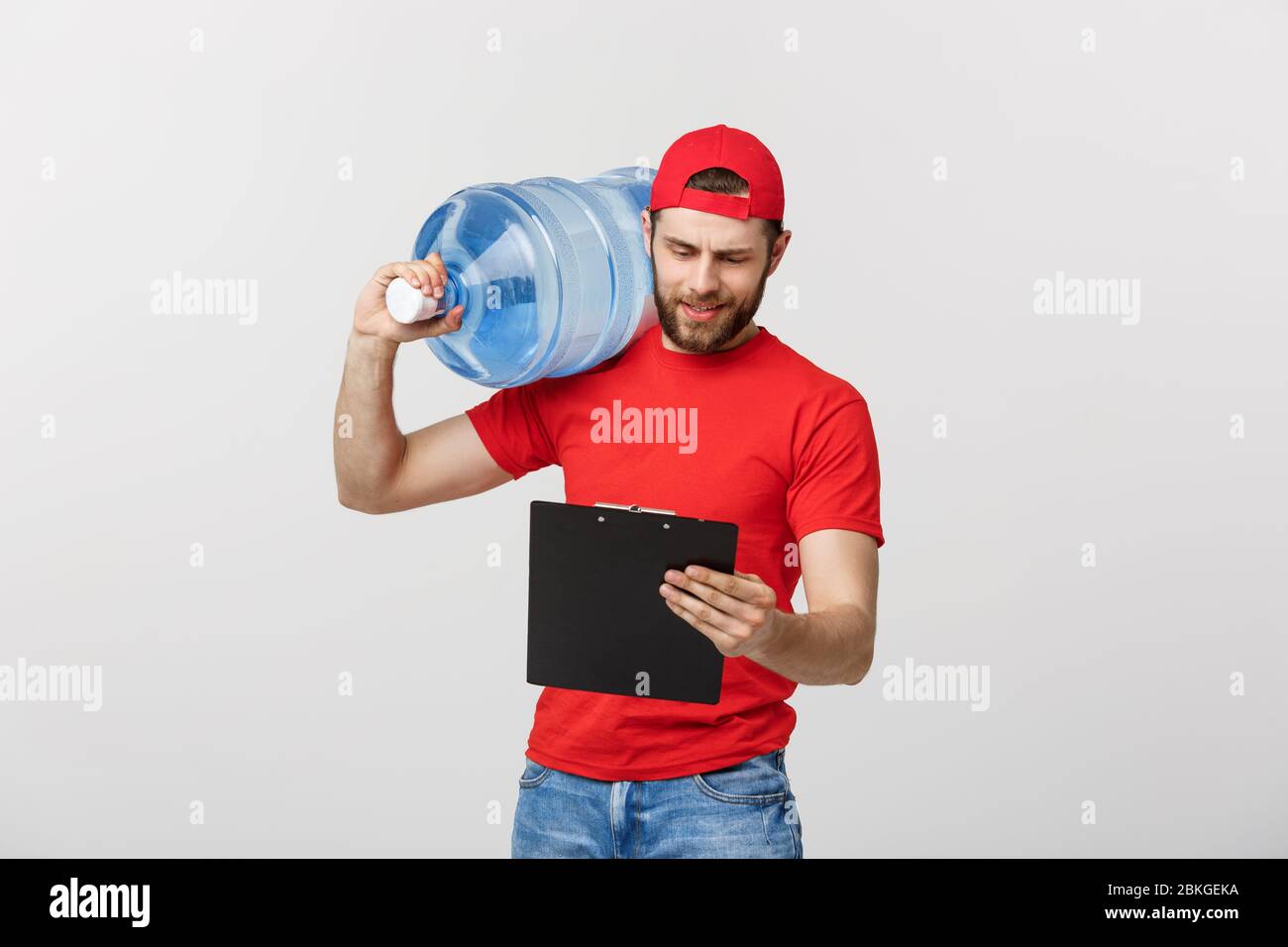Man carrying water cooler bottle hi-res stock photography and images ...