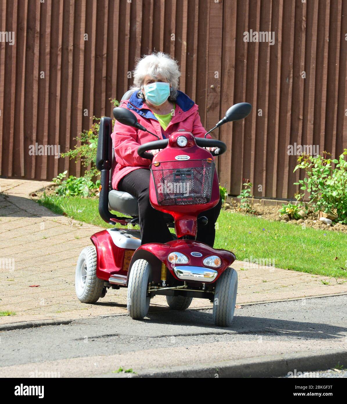 A Lady on a mobility scooter wearing PPE during the Covid-19 Lockdown ...