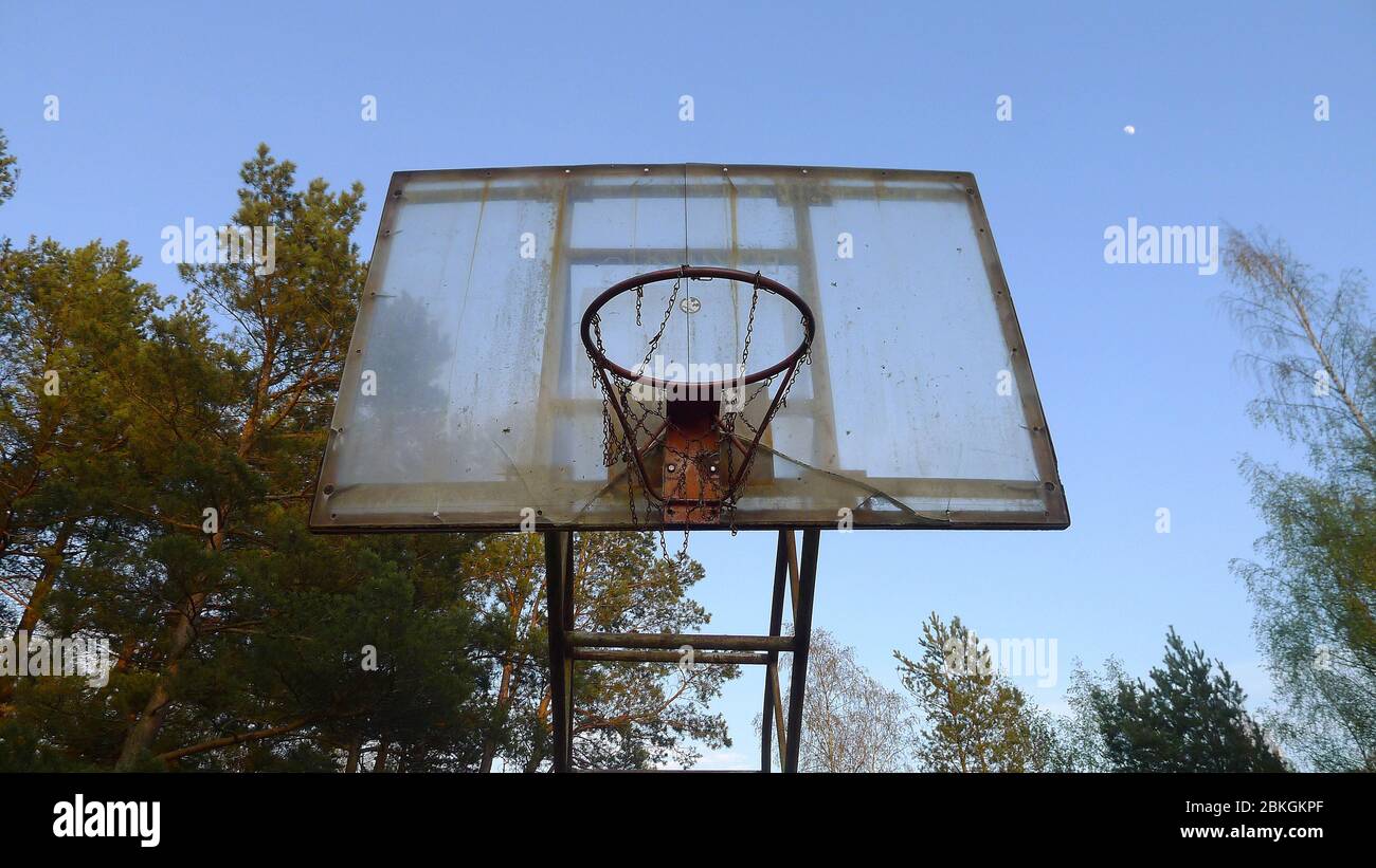 Outdoor Basketball Hoop in evening time. Outdoor basketball hoop and ...