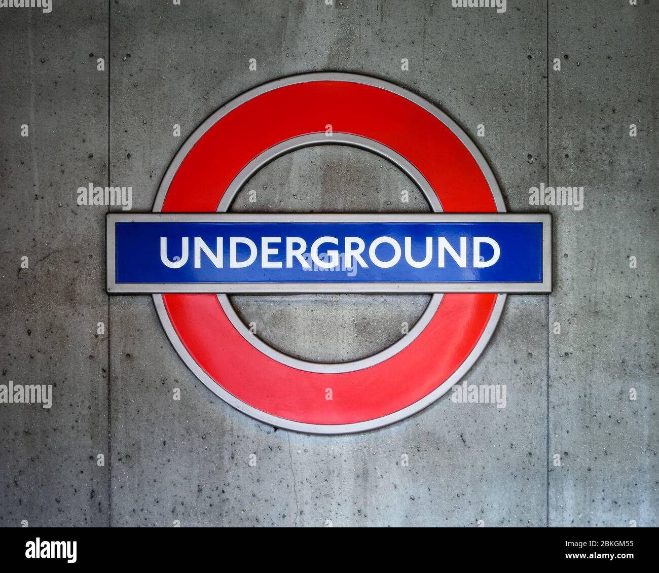 London Underground sign on concrete wall Stock Photo - Alamy