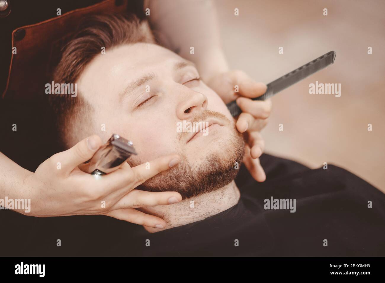 Professional barber shaves beard hi-res stock photography and images ...