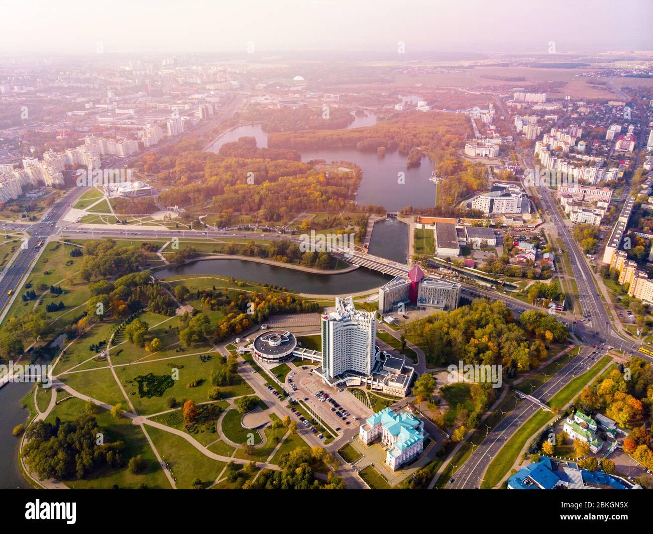 Beautiful autumn warm city landscape bird-eye view, many parks with ...