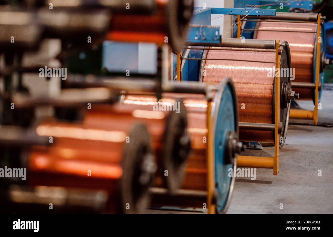 Production of copper wire, bronze cable in reels at factory Stock Photo ...