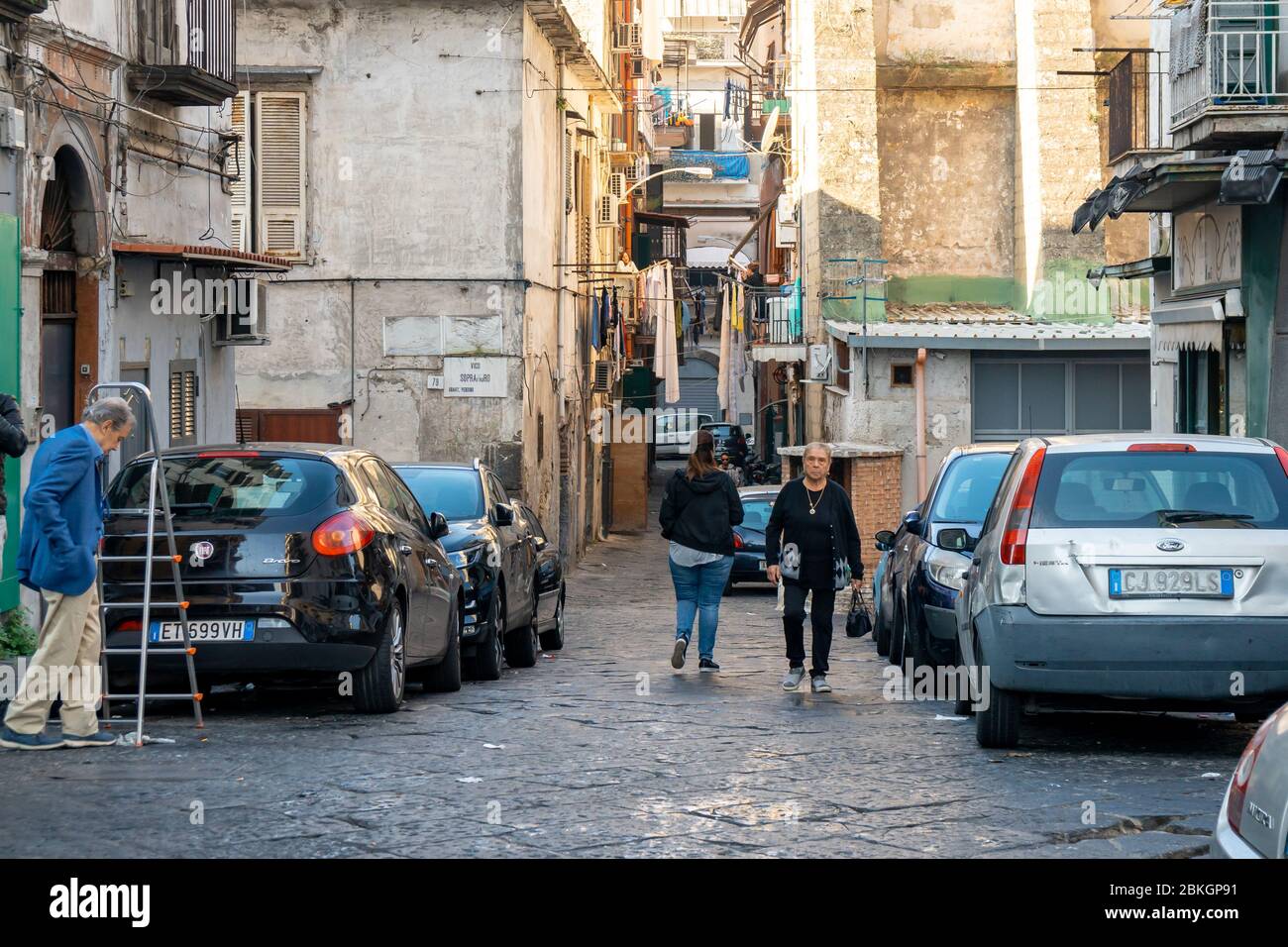 Naples, Italy - 30 October, 2019: Old dirty streets of Naples, people ...