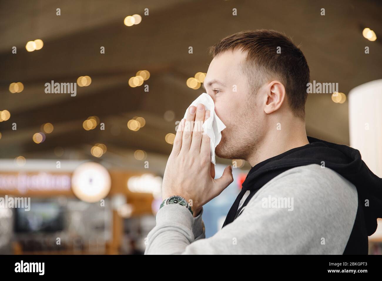 Portrait of Men uses paper handkerchief for snot from nose. Allergy ...