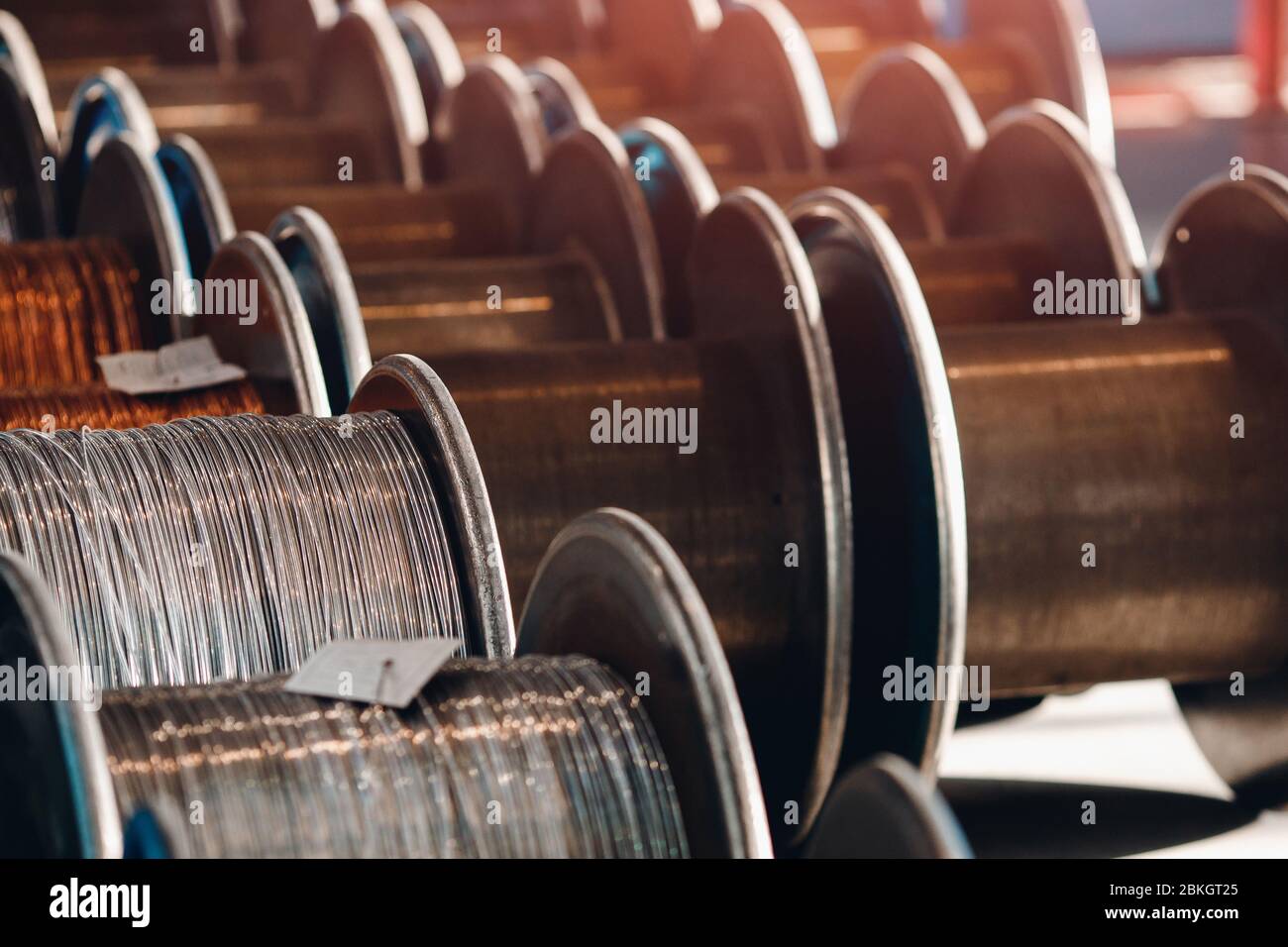 Production of copper wire, bronze cable in reels at factory Stock Photo ...