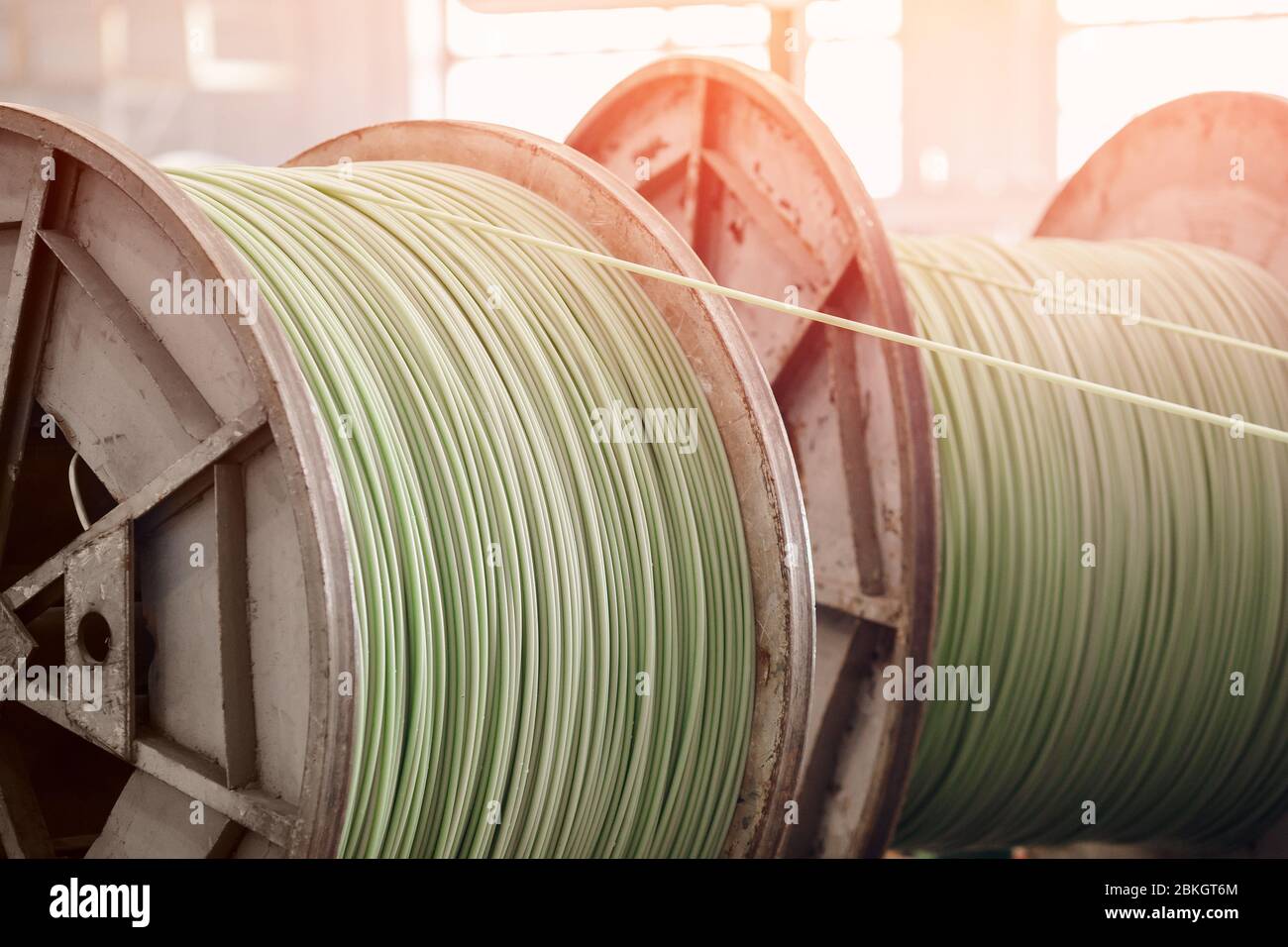 Production of copper wire, bronze cable in reels at factory Stock Photo ...