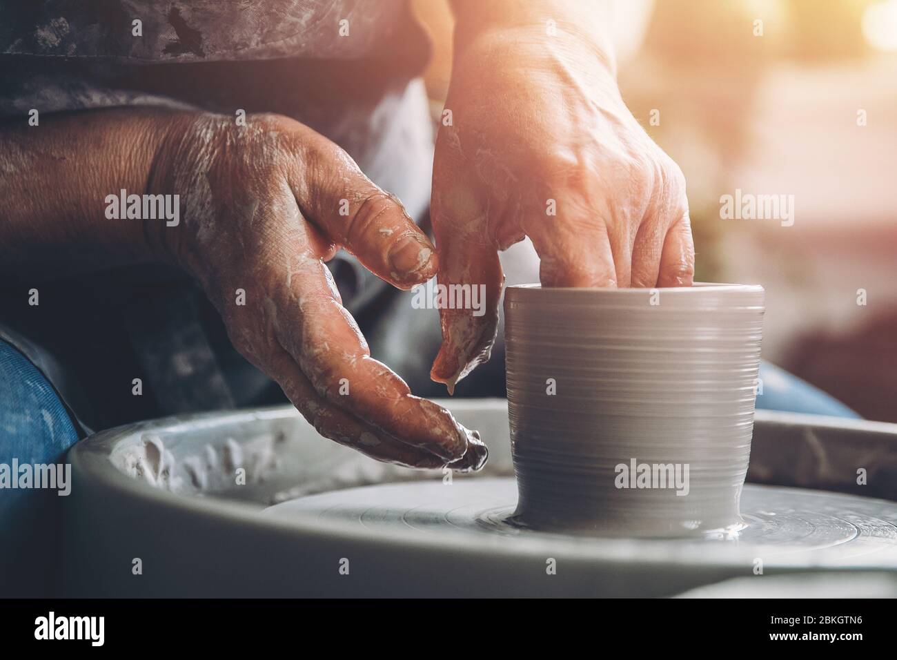 Place to work. Top view potter making ceramic pot on the pottery wheel ...