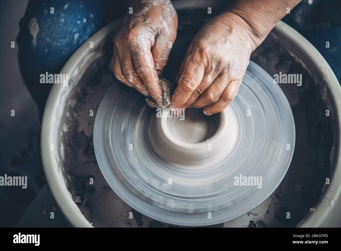 Place to work. Top view potter making ceramic pot on the pottery wheel ...