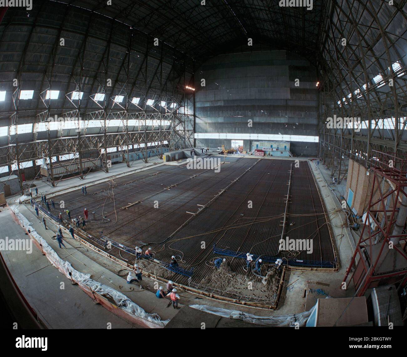 Pouring a new concrete floor at the R101 Airship hangar, at Cardington ...