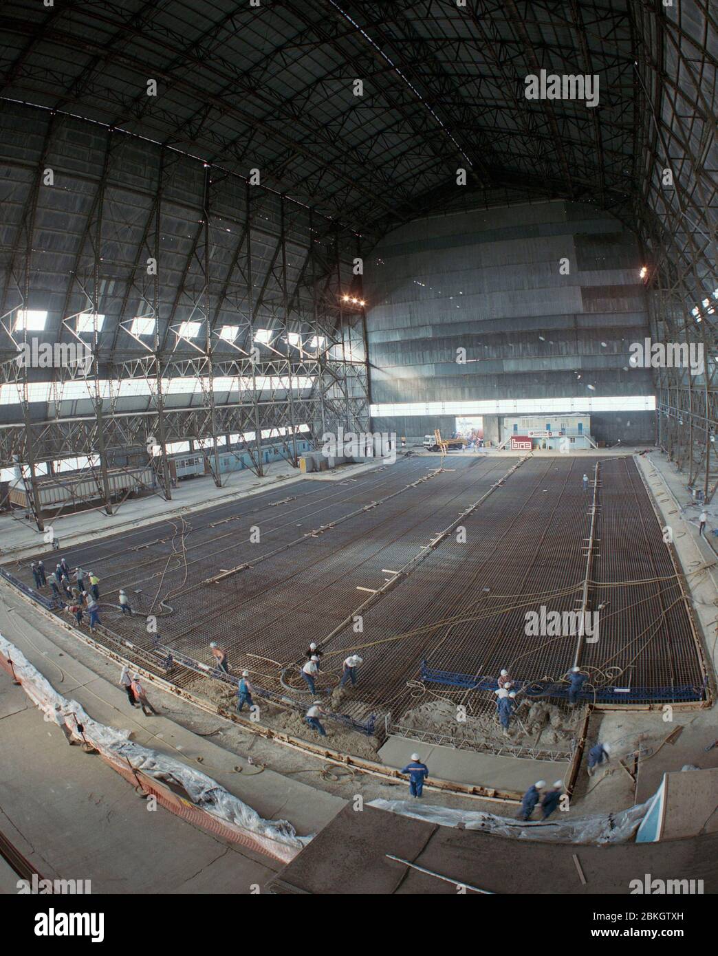 Pouring a new concrete floor at the R101 Airship hangar, at Cardington ...