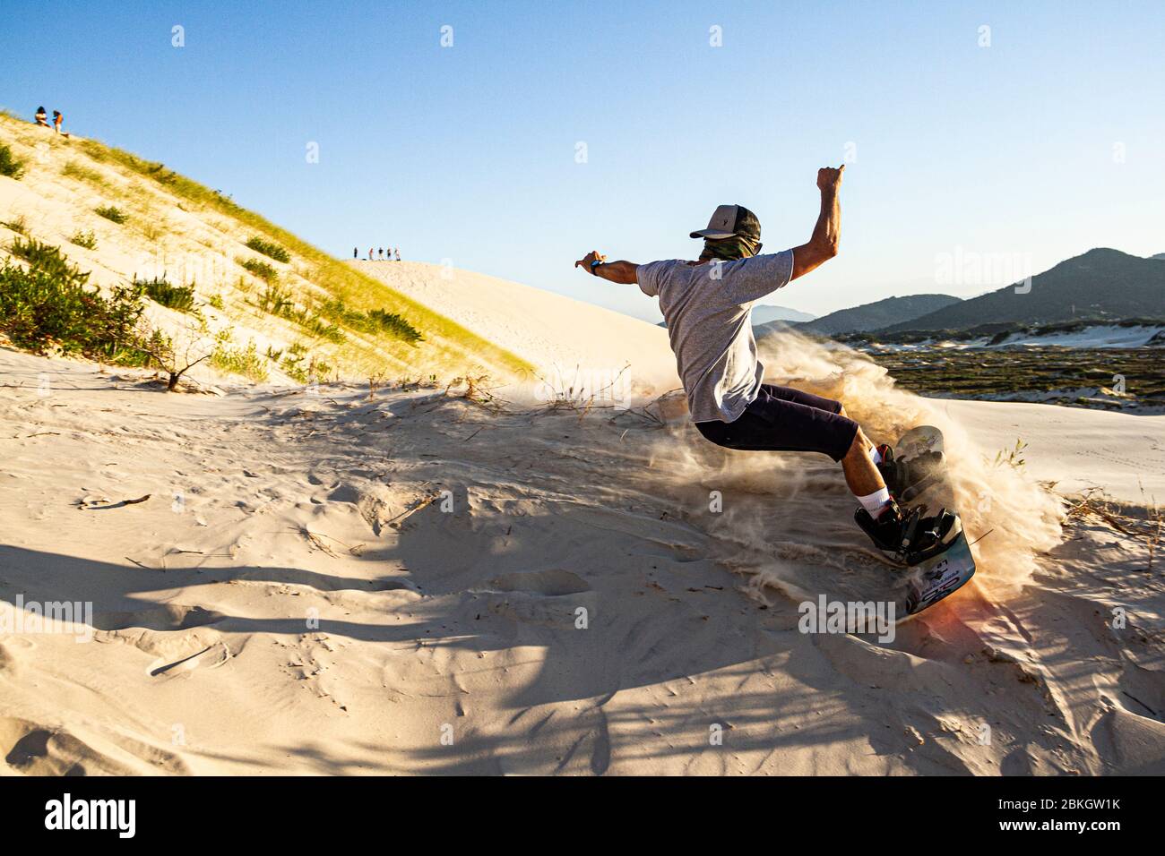 Sandboarding on the dunes of Joaquina Beach. Florianopolis, Santa ...
