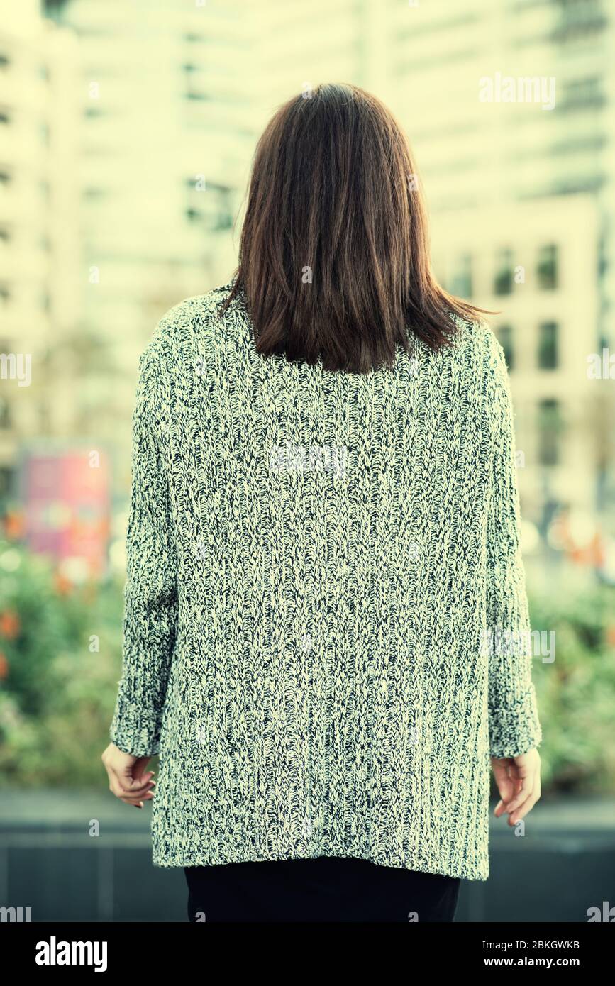 Rear view of a woman standing outdoors Stock Photo - Alamy