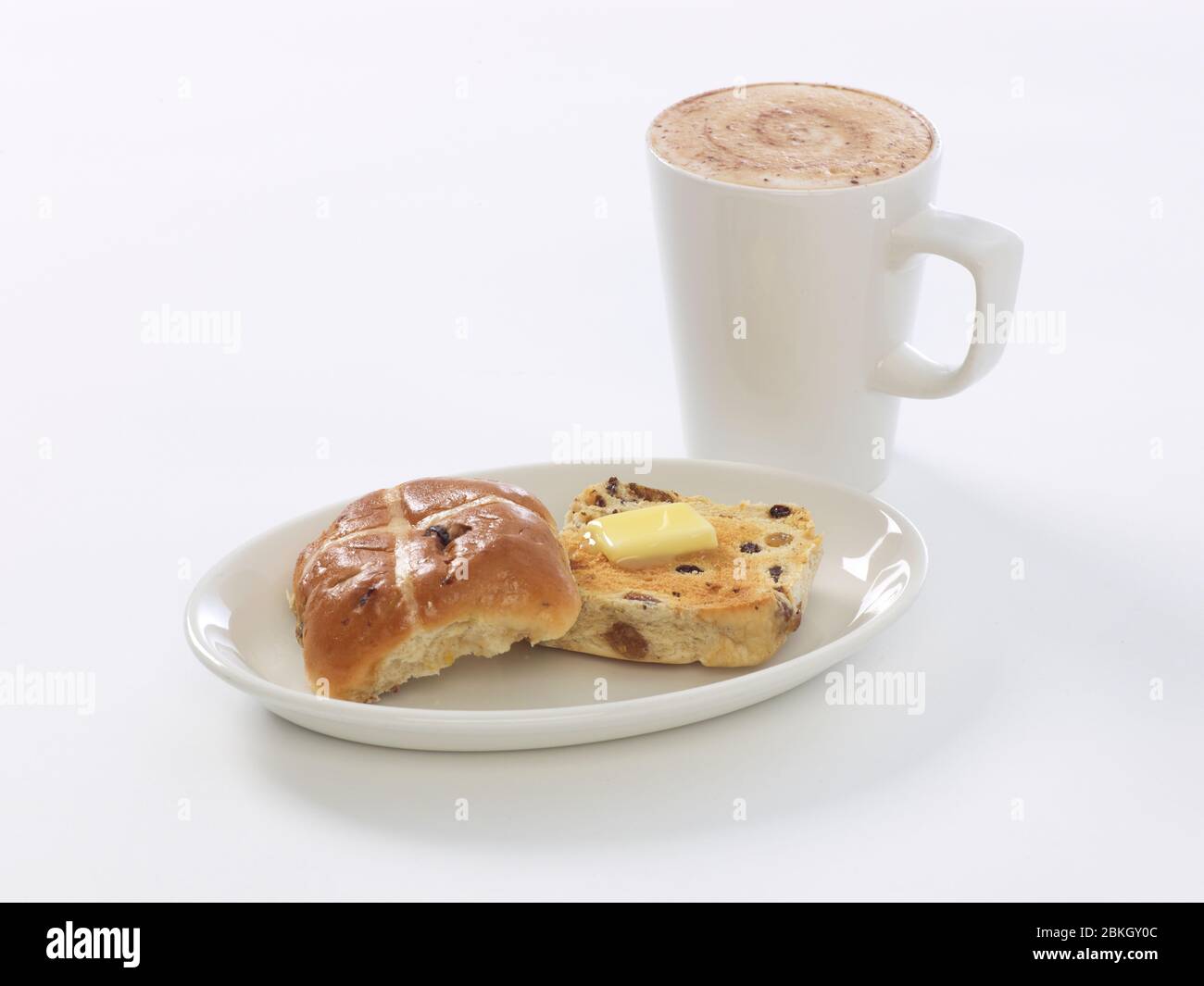 coffee and hot cross bun Stock Photo - Alamy