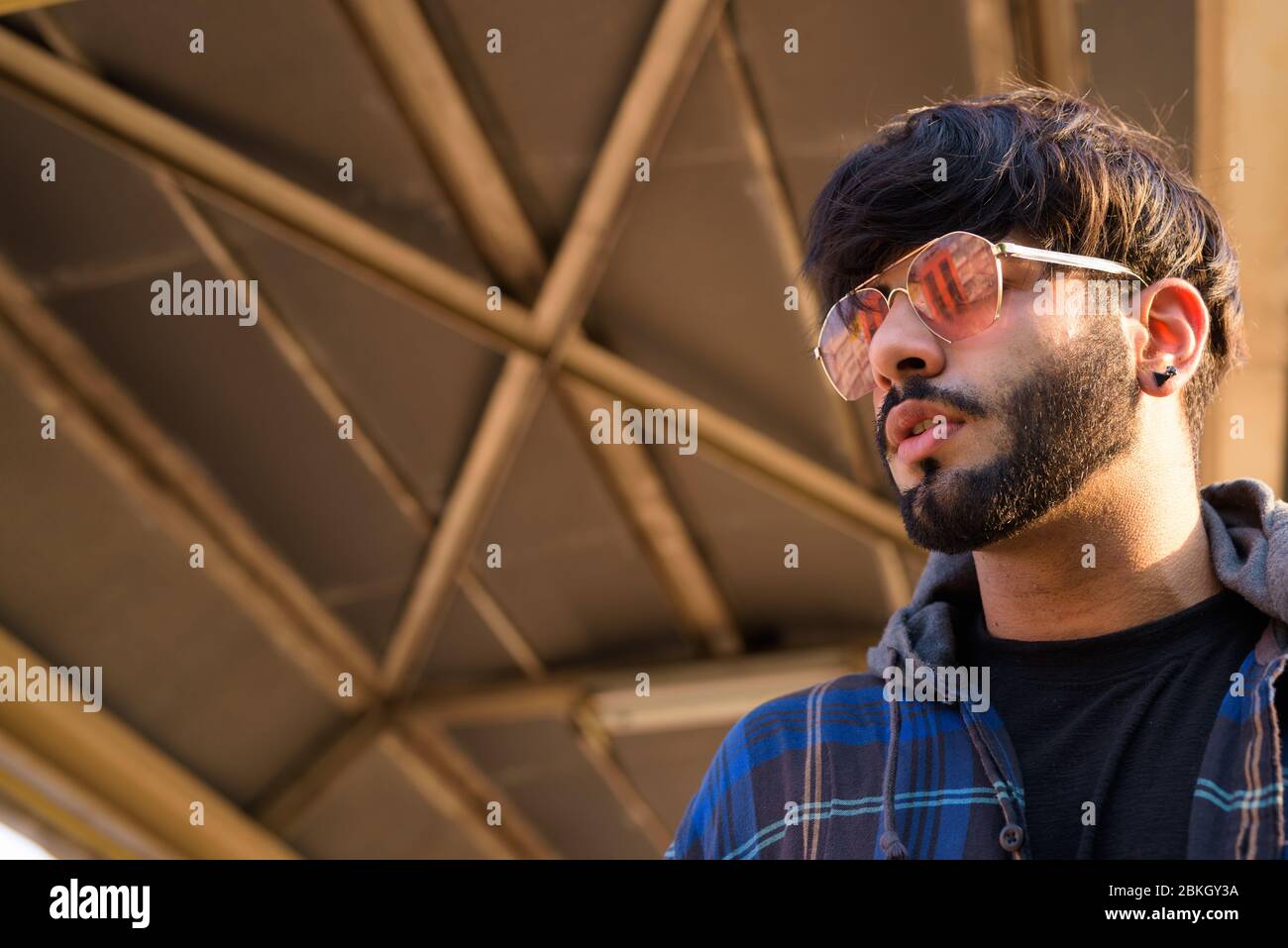 Young handsome bearded Indian man at the footbridge Stock Photo - Alamy