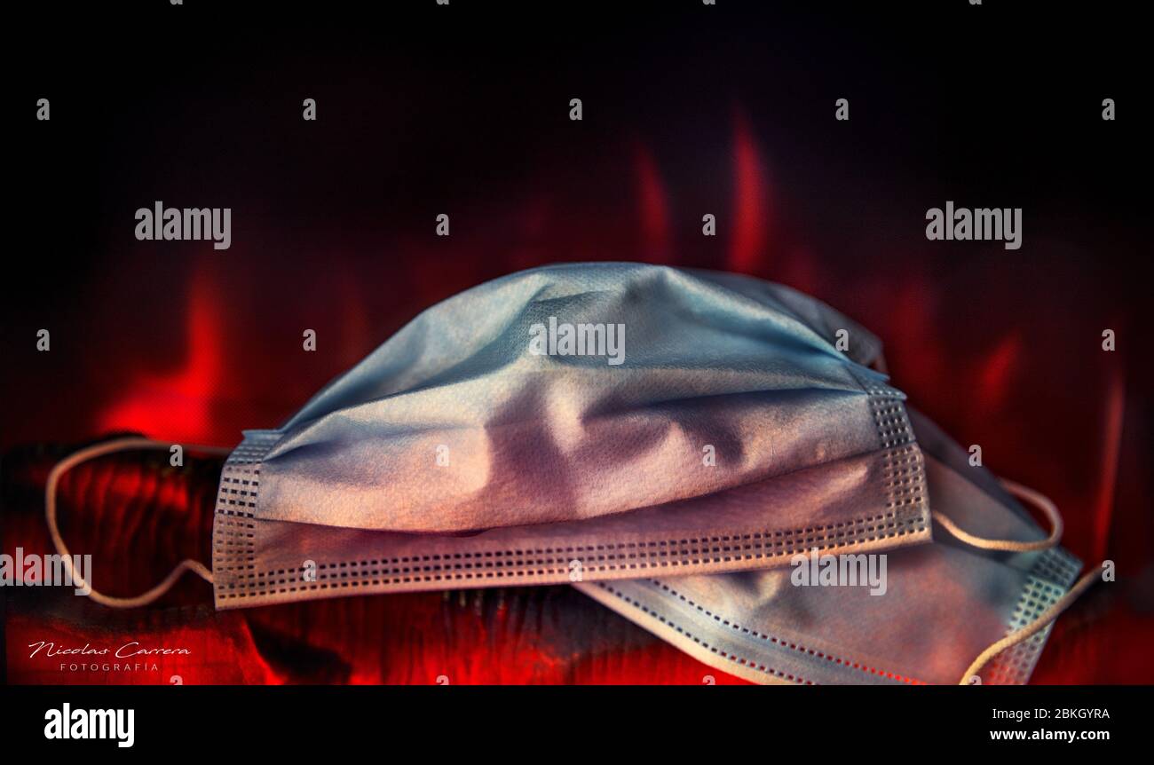 surgical masks over burning fire Stock Photo - Alamy