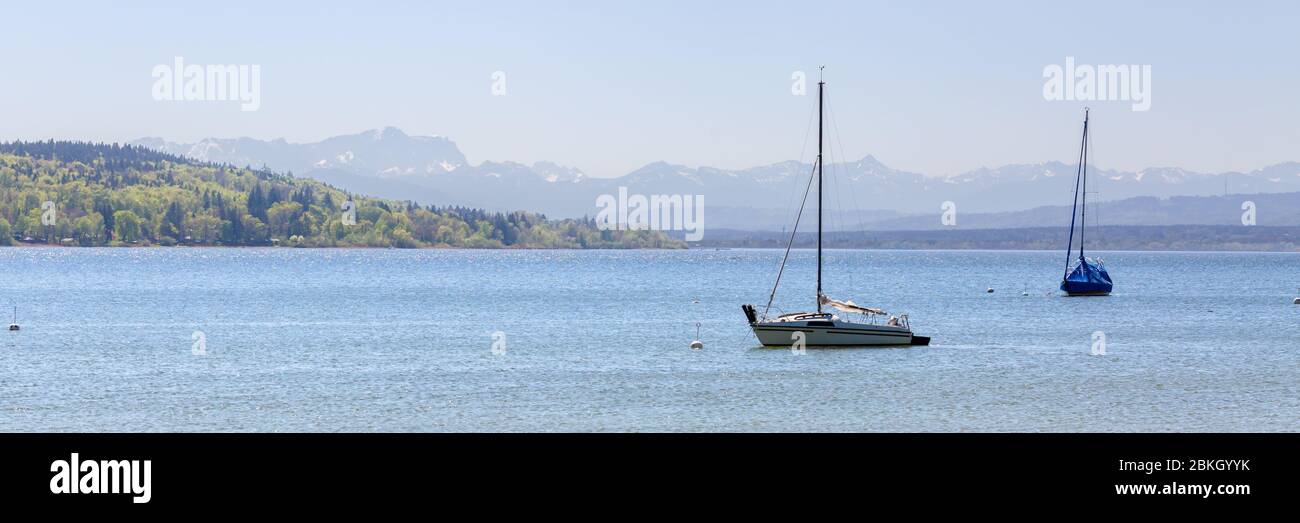 Two sailboats at Lake Ammer (Ammersee). In the distance the European ...