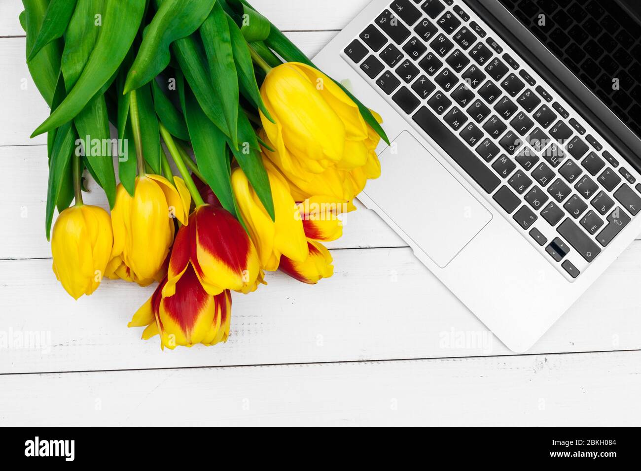 Easter eggs, mockup laptop and bouquet of tulips Stock Photo - Alamy