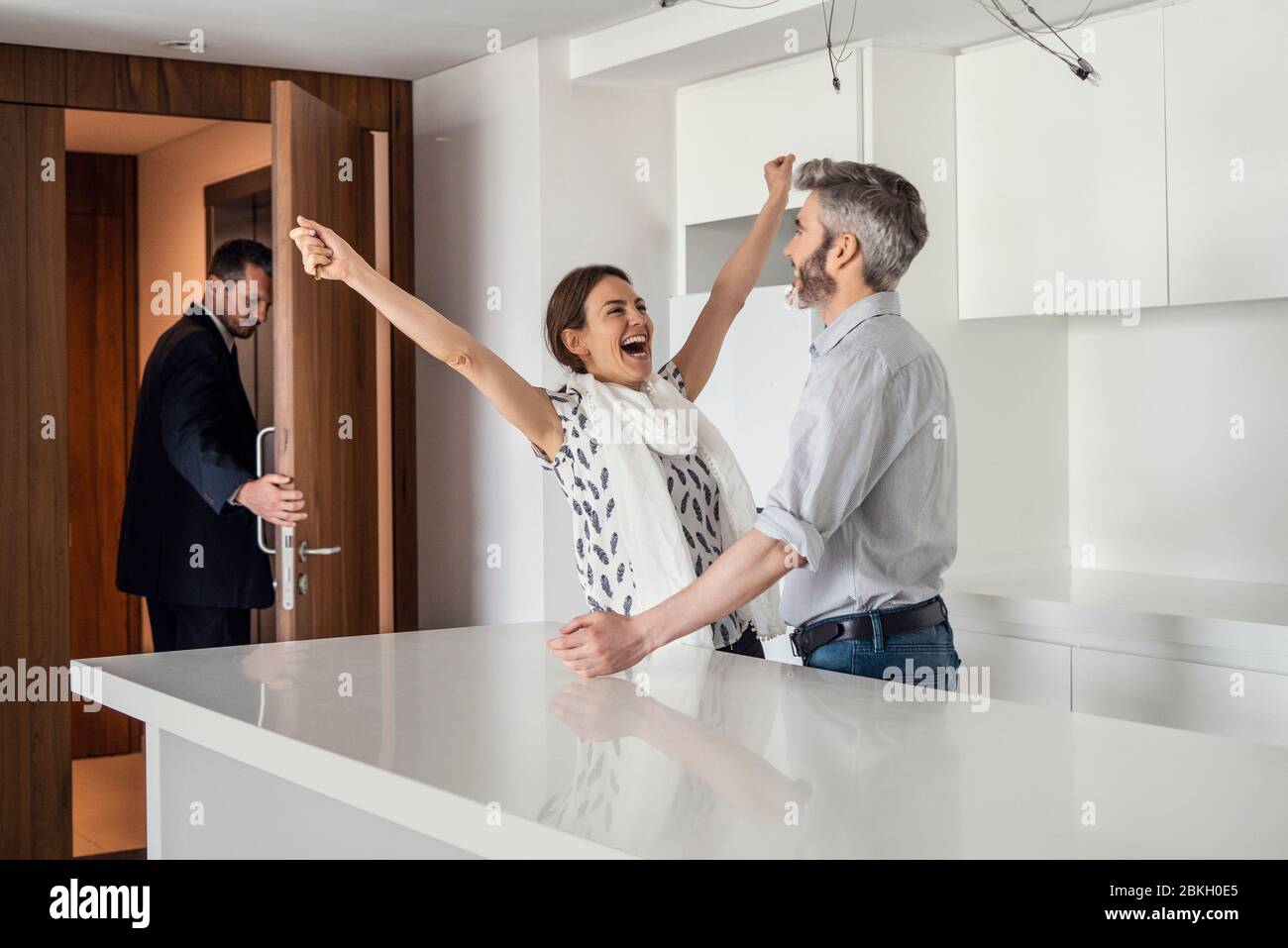 Couple celebrating with excitement Stock Photo - Alamy