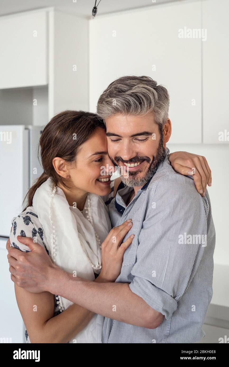 Embracing smiling happiness excitement bonding standing hi-res stock ...