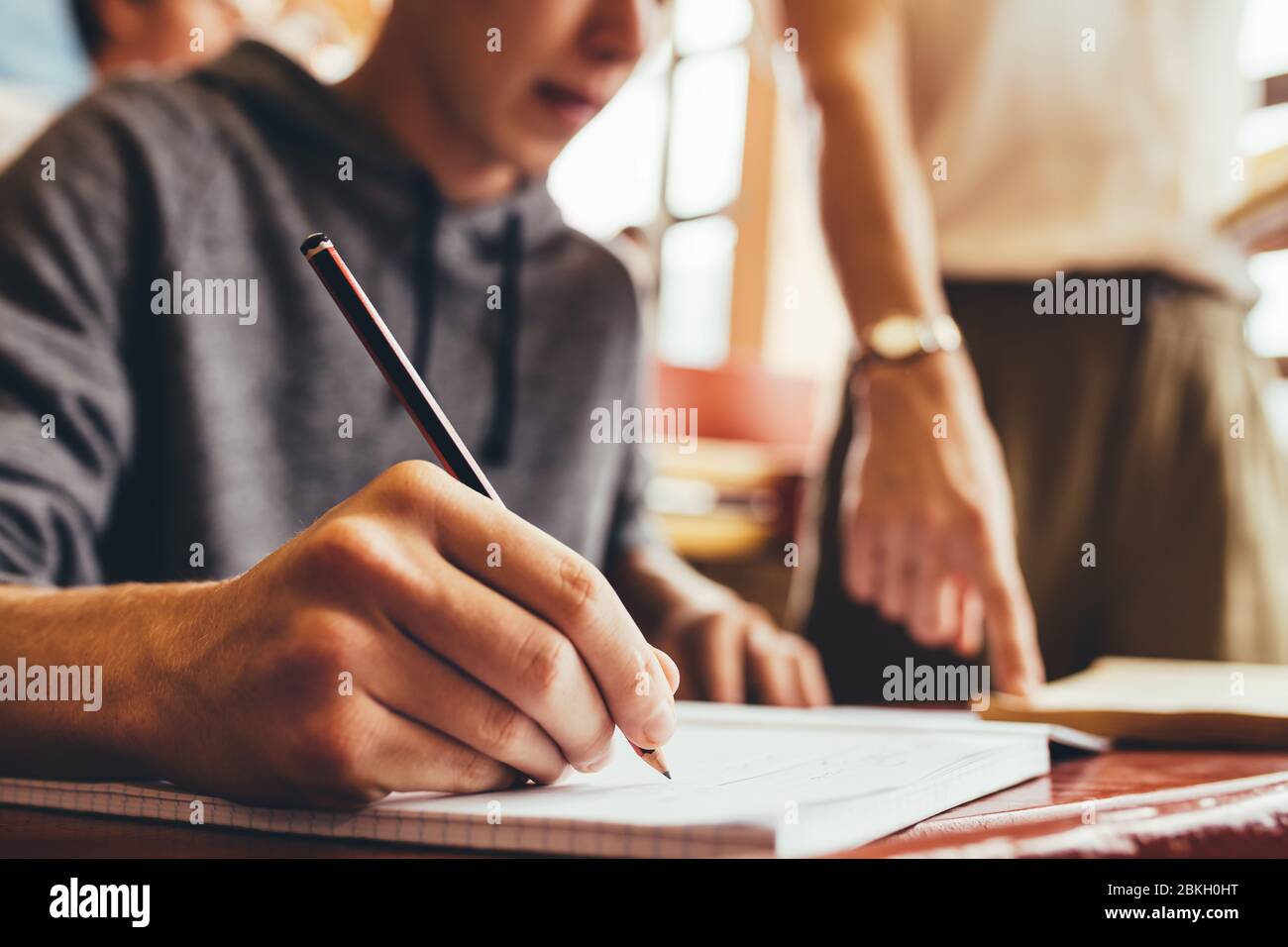 Boy pointing at book hi-res stock photography and images - Alamy