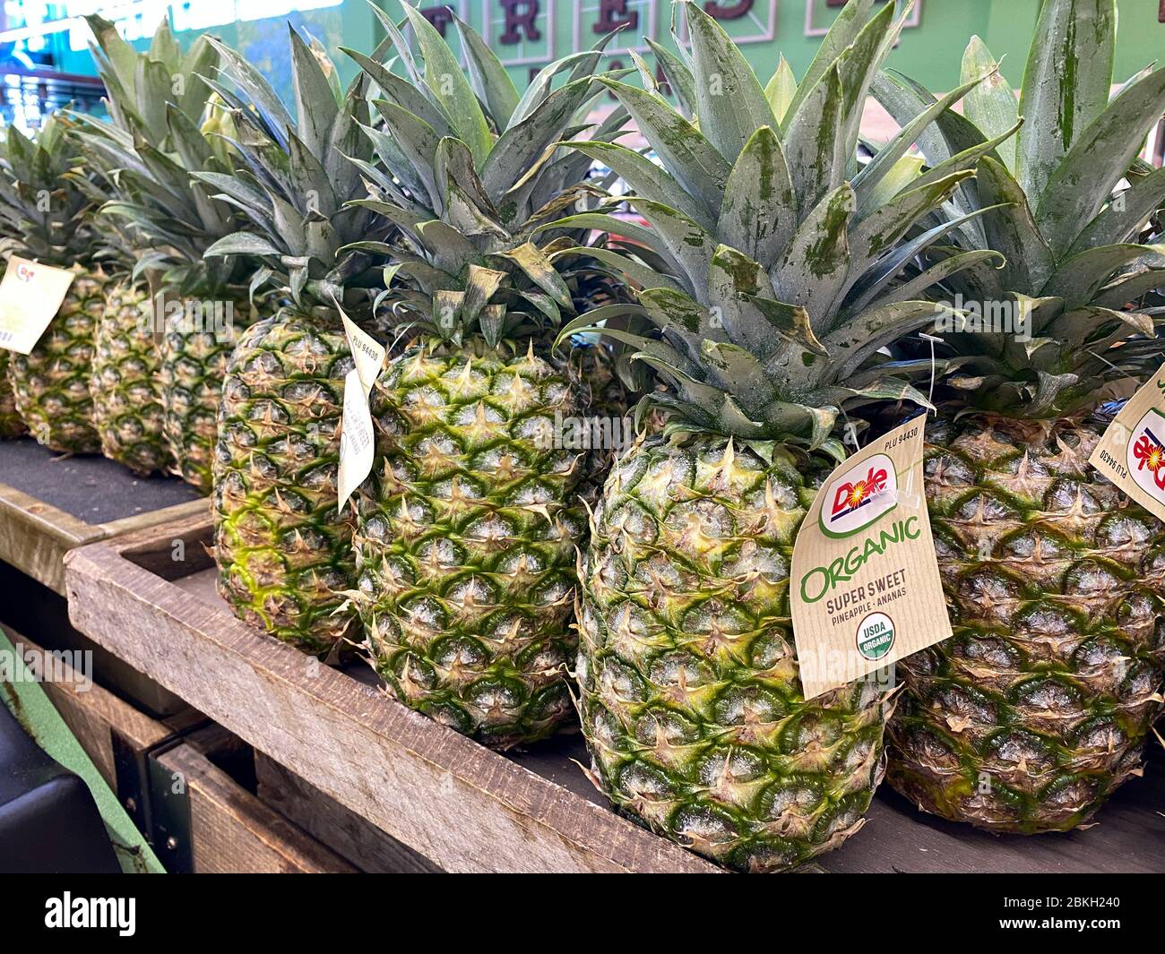 Orlando,FL/USA-5/3/20: A row of fresh Dole Pineapples at a Whole Foods ...