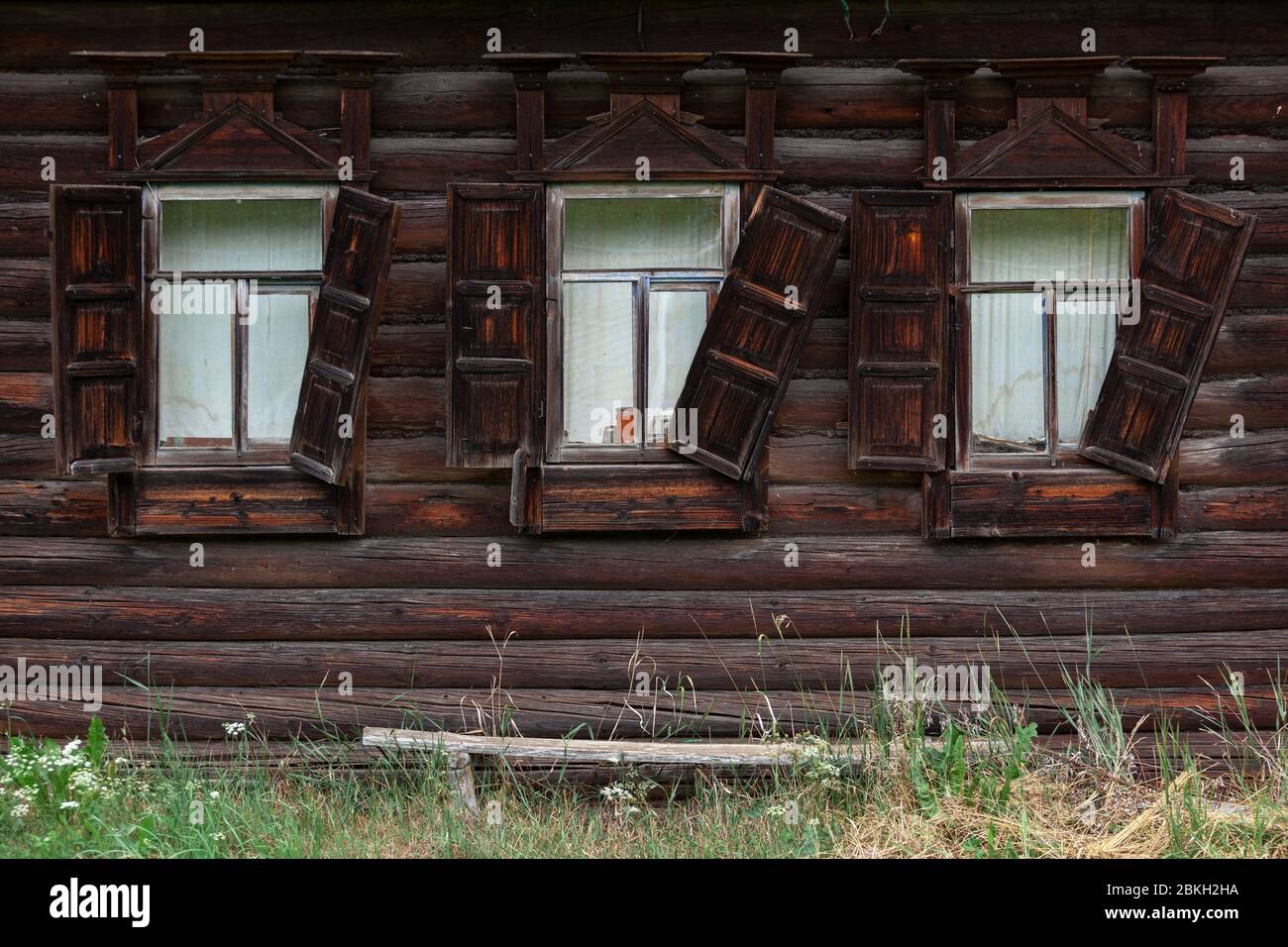 Windows of an old wooden hut in the village Stock Photo - Alamy