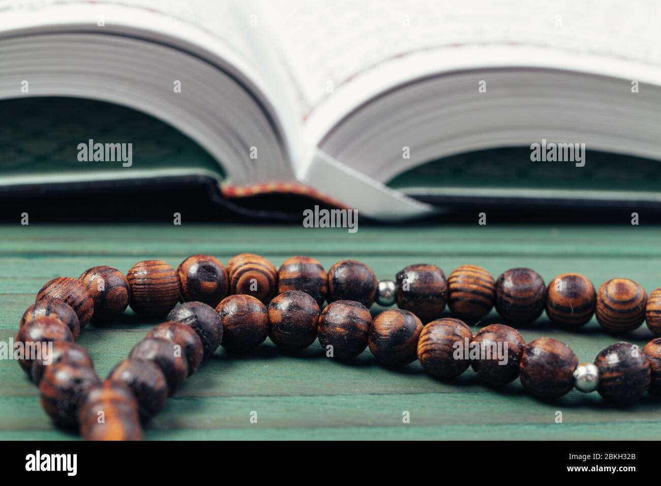 The Open holy Quran with tasbih rosary beads close up Stock Photo - Alamy