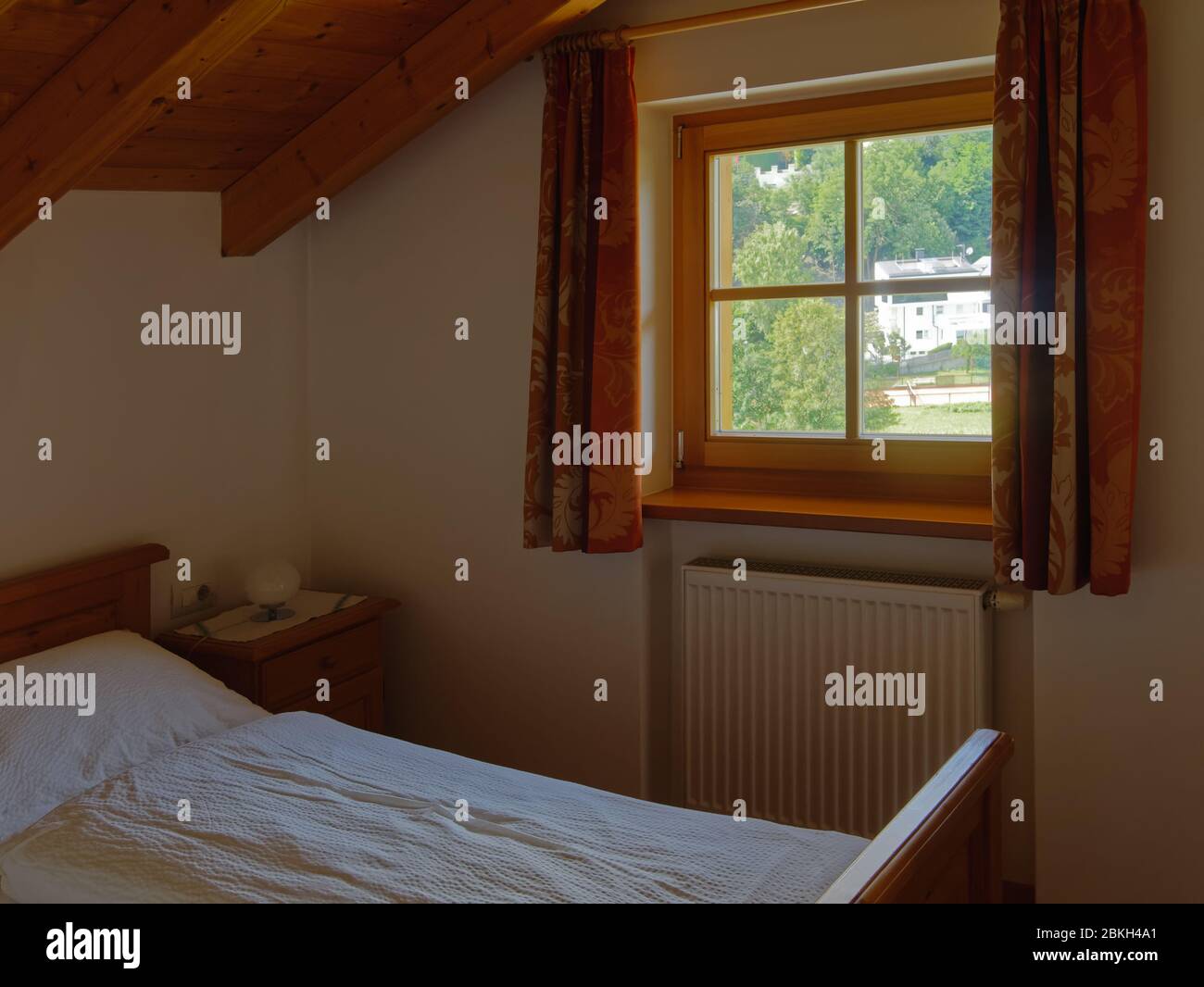 Interior of mountain wooden lodge bedroom with window Stock Photo - Alamy
