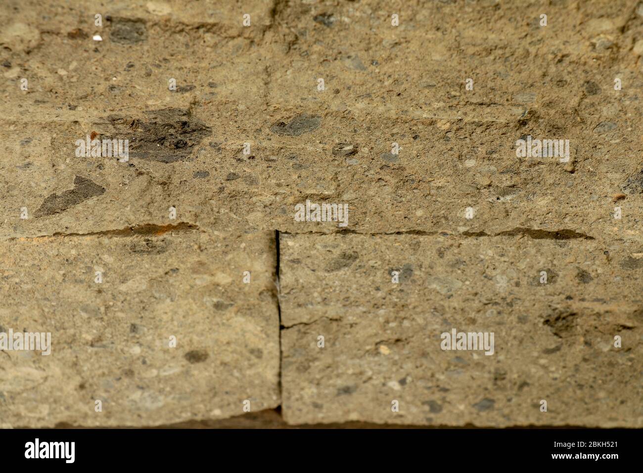 Stone wall made of roughly worked stones of natural color. Selective ...