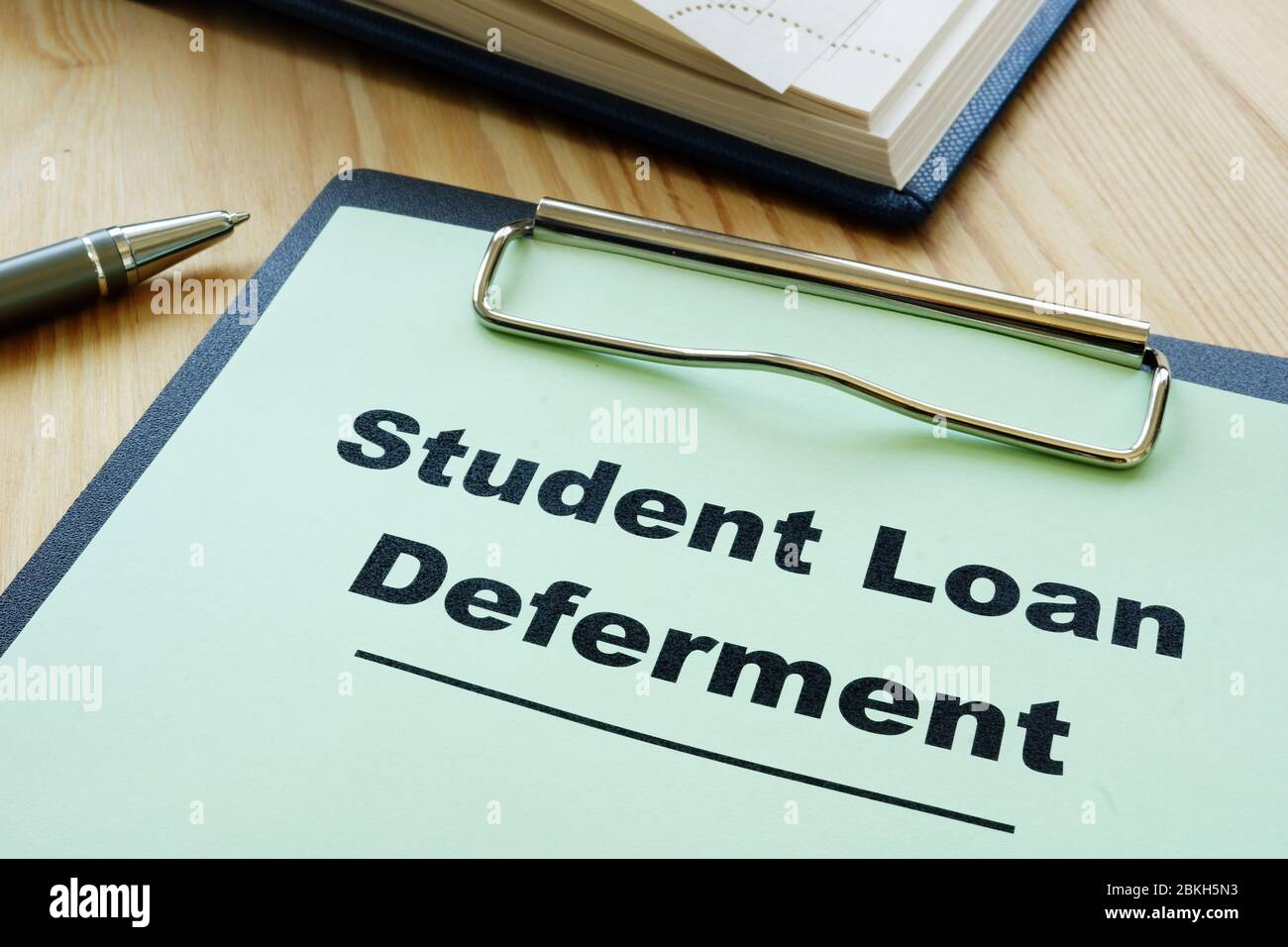 Student loan deferment application and clipboard Stock Photo - Alamy