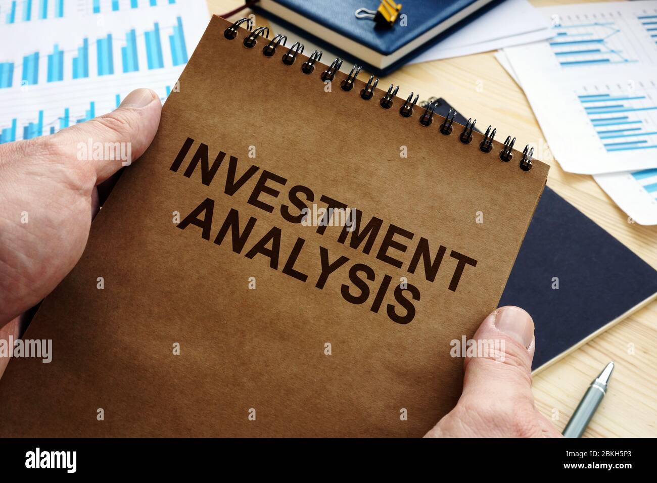Investment Analysis report in the office Stock Photo - Alamy