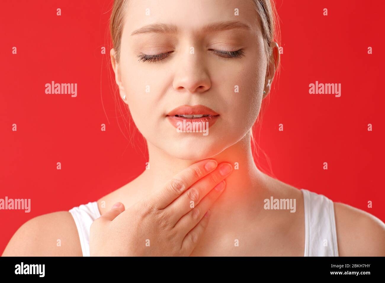 Young woman with thyroid gland problem on color background Stock Photo ...