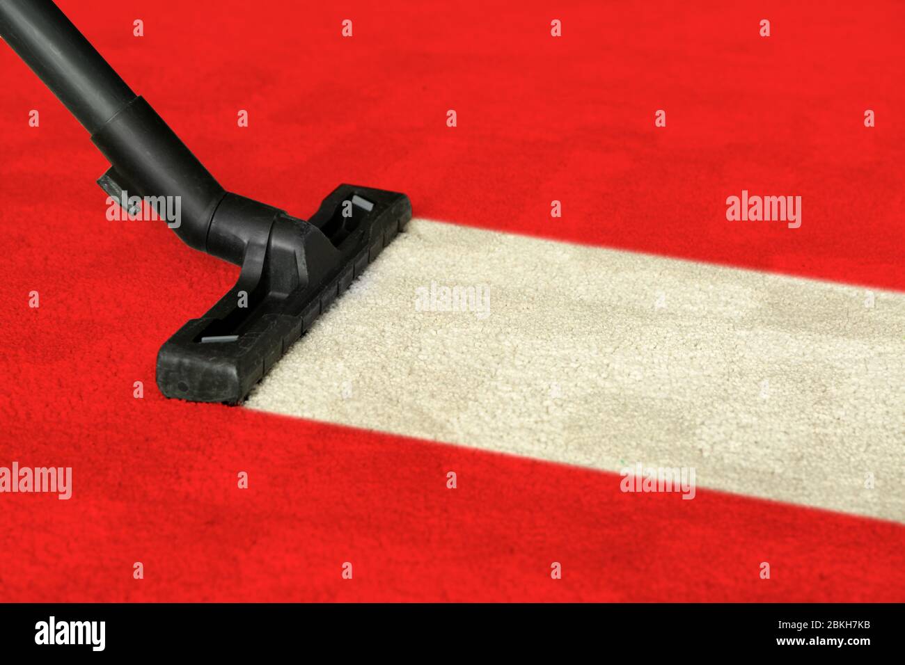 Hoovering of carpet with vacuum cleaner Stock Photo - Alamy