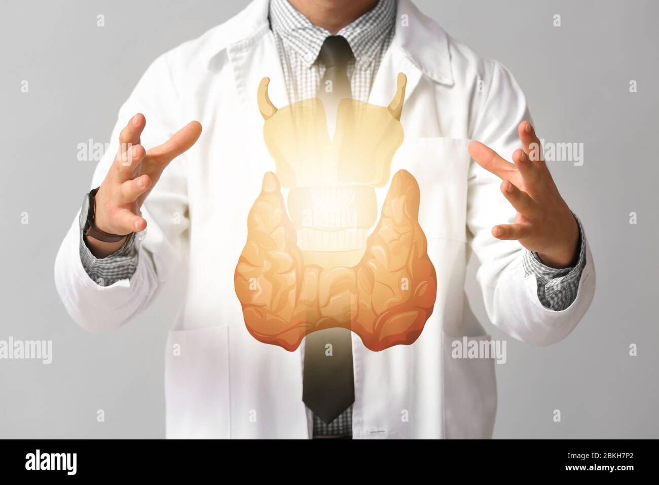 Endocrinologist with virtual model of thyroid gland on color background ...