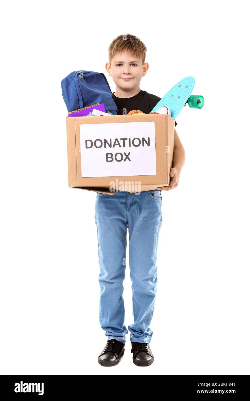 Little boy with donations on white background Stock Photo - Alamy