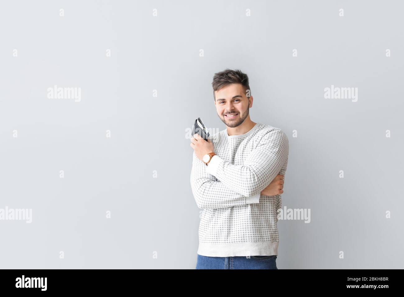 Man with purse hi-res stock photography and images - Alamy