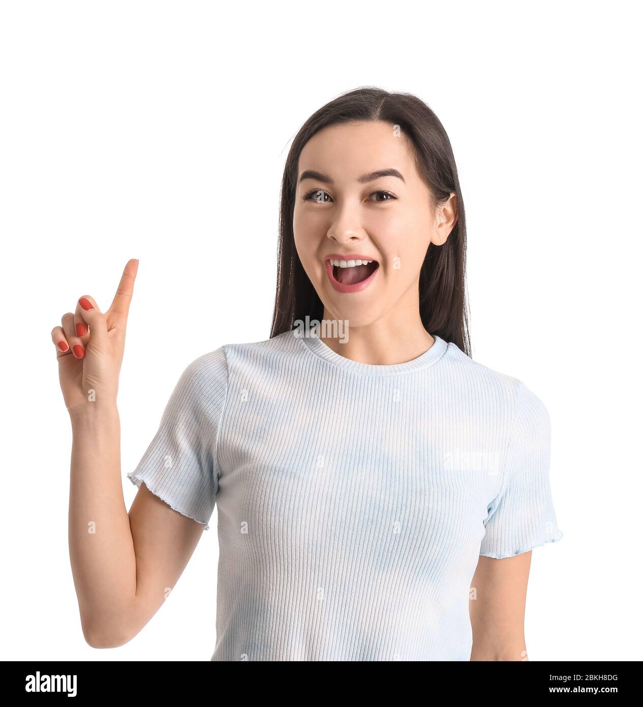 Portrait of beautiful young woman with raised index finger on white ...