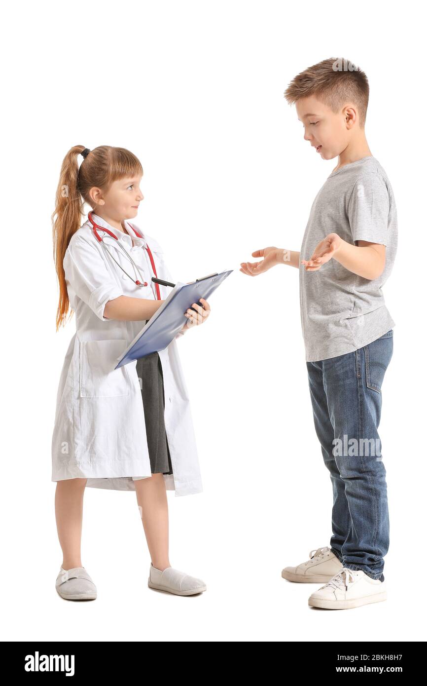 Cute little doctor with patient on white background Stock Photo - Alamy