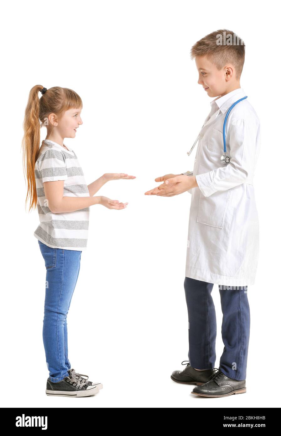 Cute little doctor with patient on white background Stock Photo - Alamy