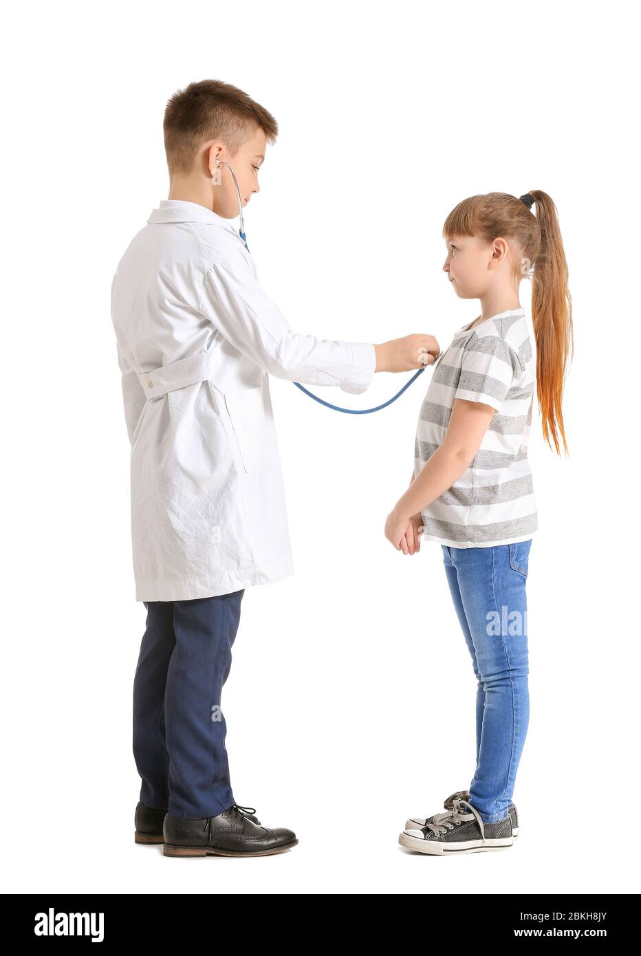 Cute little doctor with patient on white background Stock Photo - Alamy