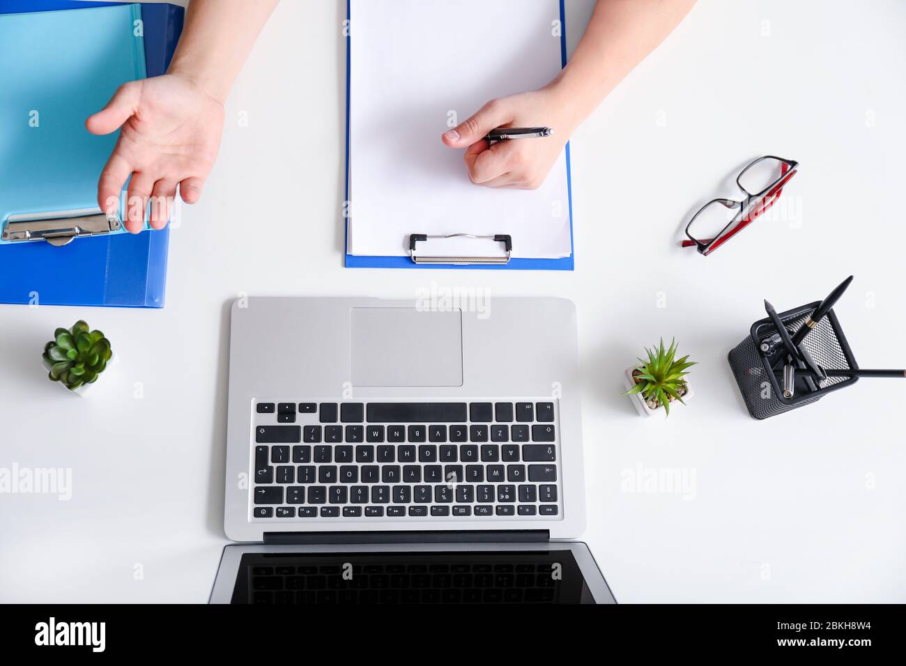 Male doctor at table in clinic, top view Stock Photo - Alamy