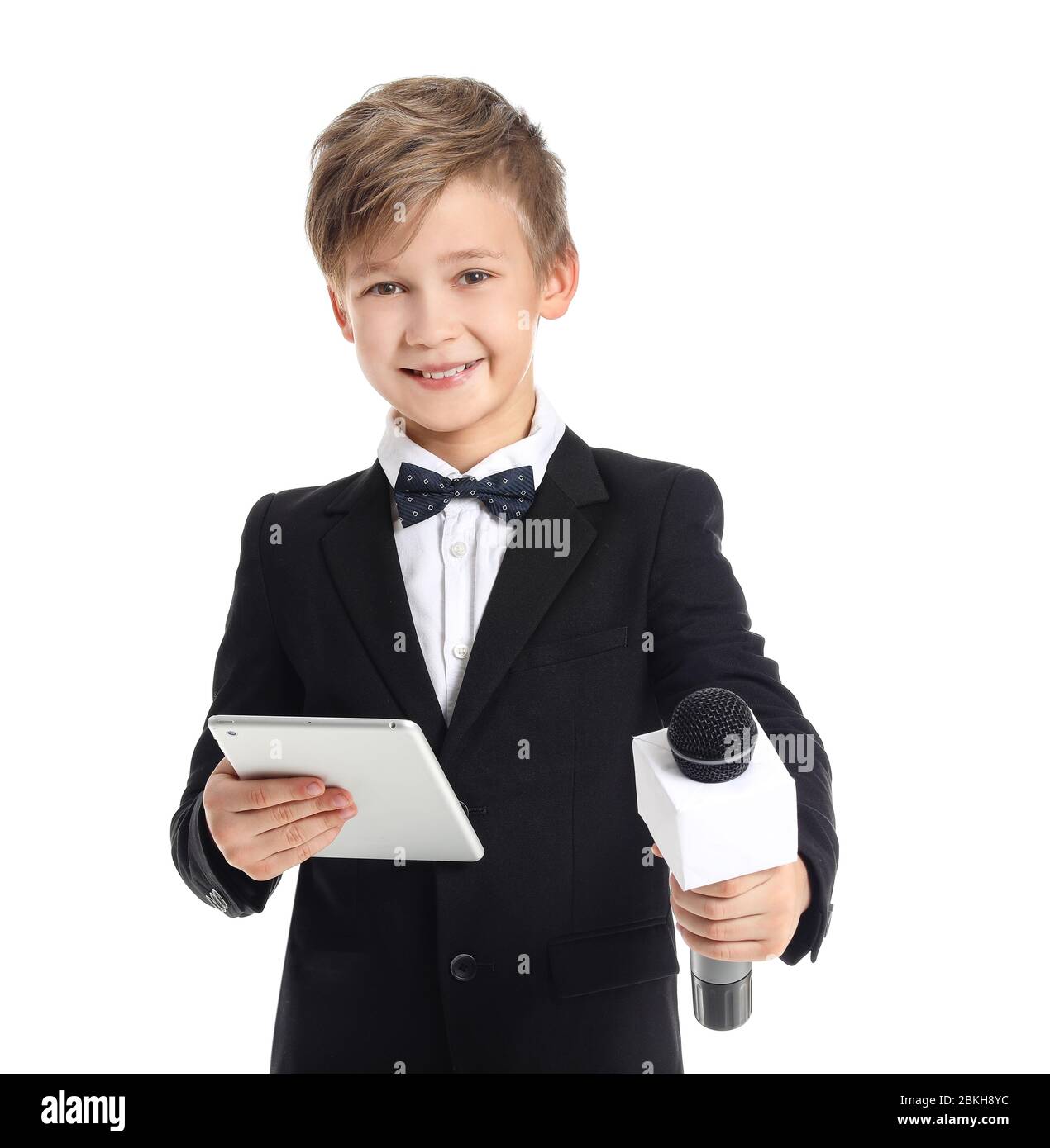 Little journalist with microphone and tablet computer on white ...