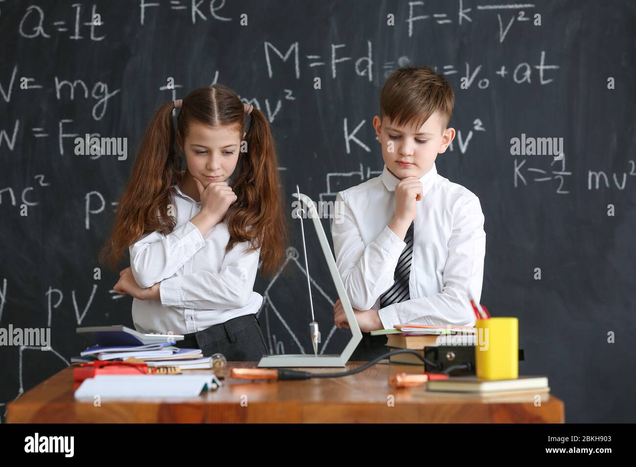 Cute little children at physics lesson in classroom Stock Photo - Alamy