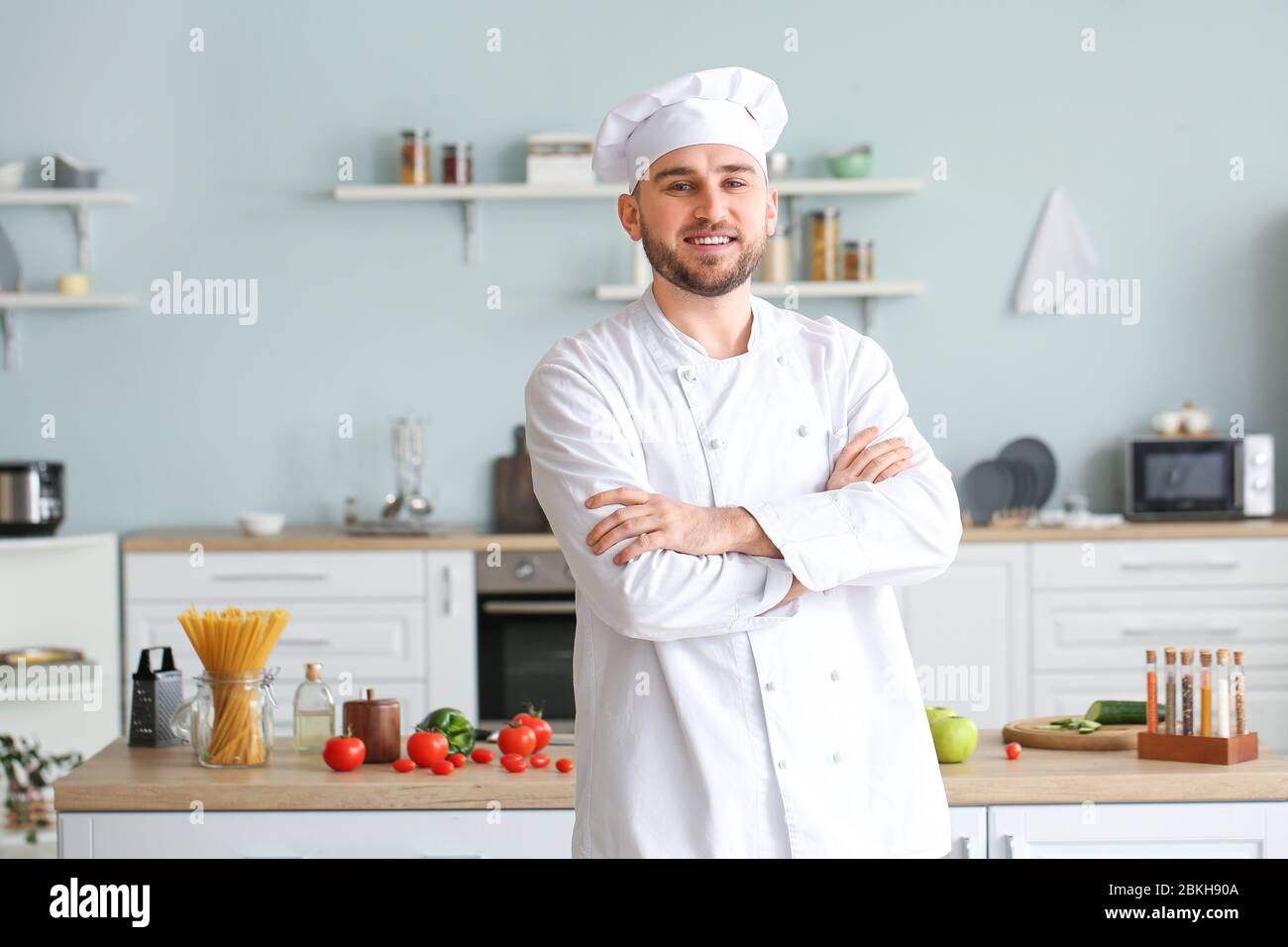 Handsome male chef in kitchen Stock Photo - Alamy