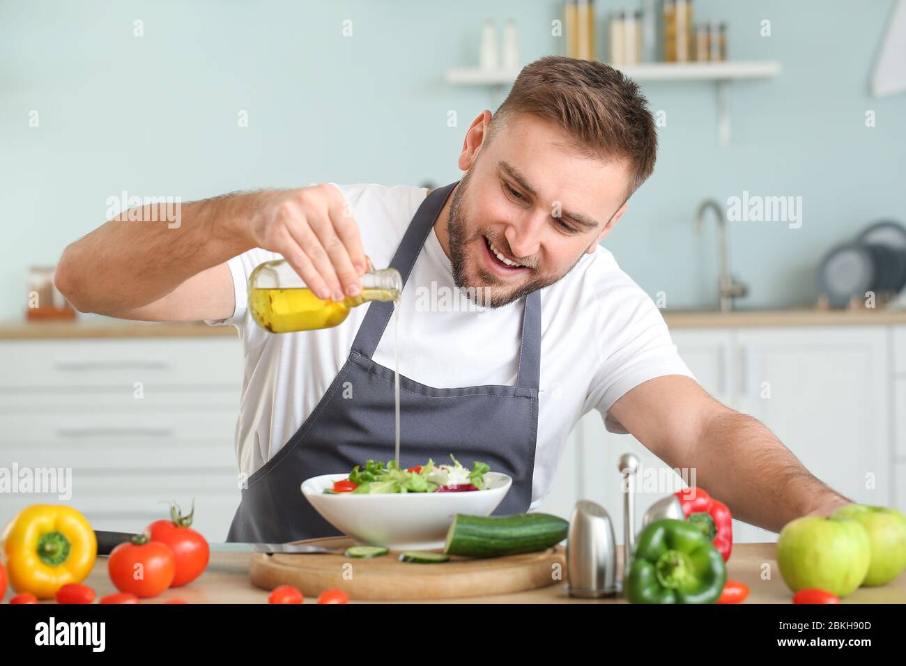 Handsome male chef dressing hi-res stock photography and images - Alamy