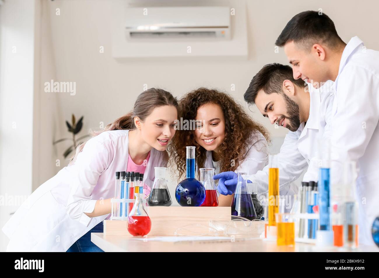 Young people at chemistry lesson in classroom Stock Photo - Alamy