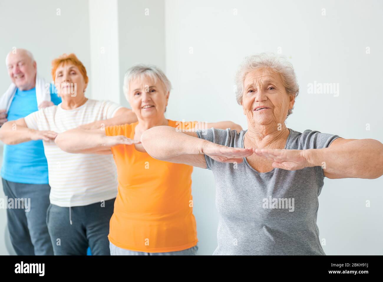 Elderly people exercising in gym Stock Photo - Alamy